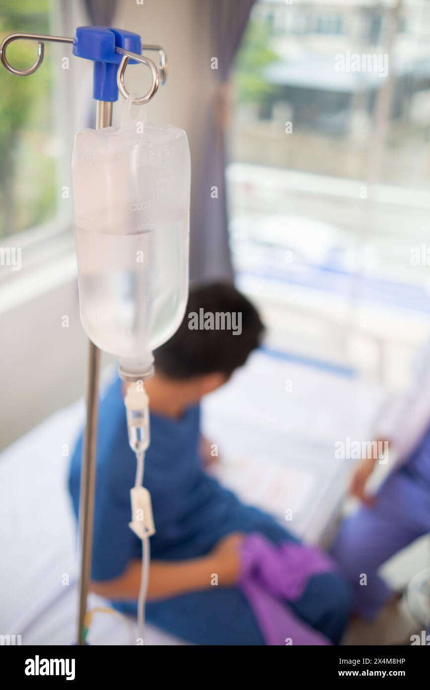 An iron stand to hang saline bottle high to deliver saline via catheter ...