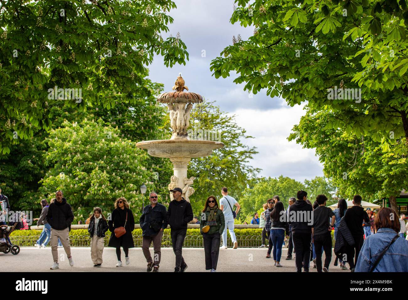 Madrid, Spain. 2 May 2024 A crowd of people walking on a city street in ...