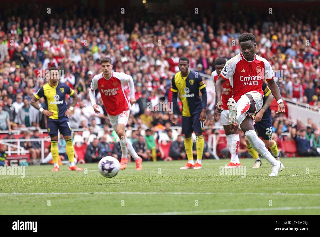 London, UK. 04th May, 2024. Bukayo Saka (A) scores from the penalty spot for the first Arsenal ...