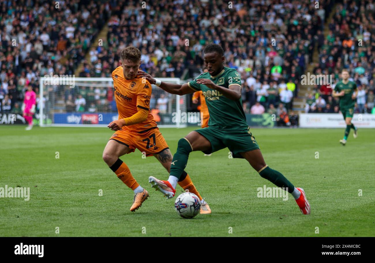 Plymouth Argyle's Bali Mumba and Hull City's Regan Slater in action during the Sky Bet ...