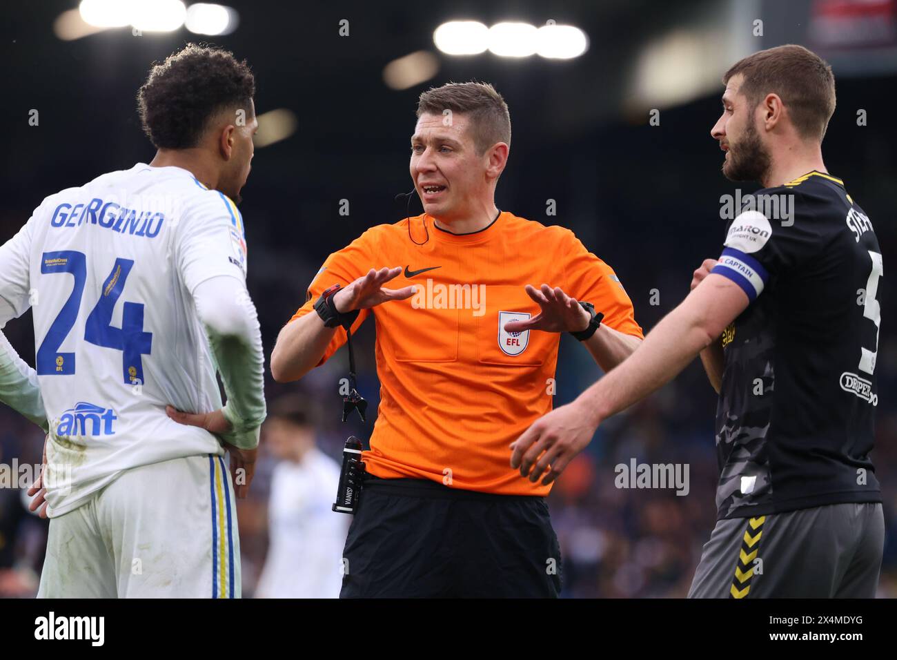 Matt Donohue, the match referee, talks to Georginio Rutter (Leeds ...