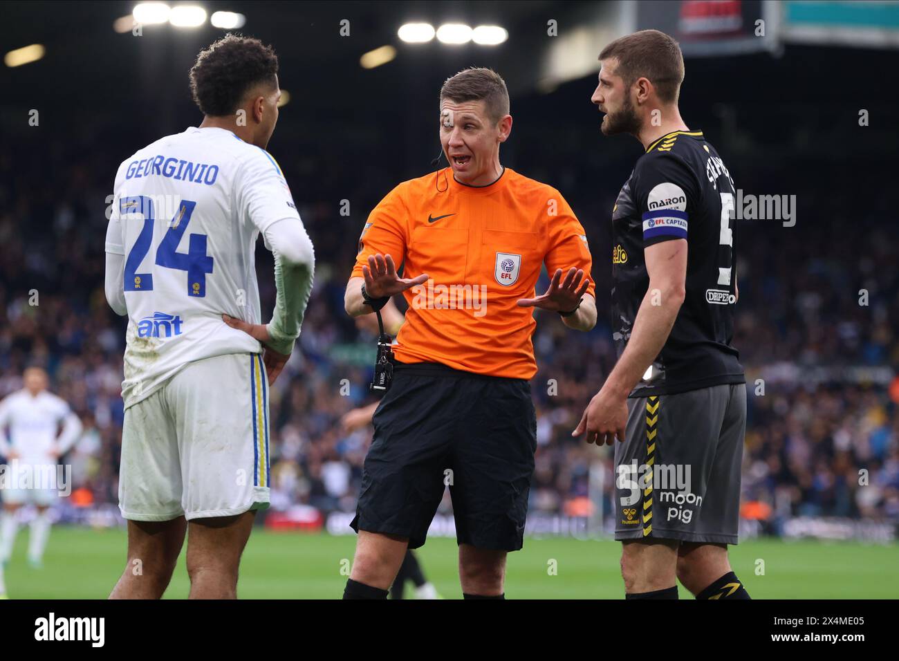 Matt Donohue, the match referee, talks to Georginio Rutter (Leeds ...