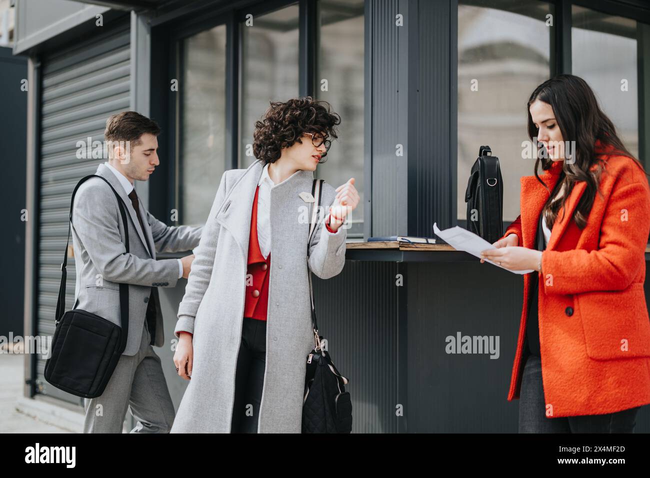 Business associates engaged in hi-res stock photography and images - Alamy