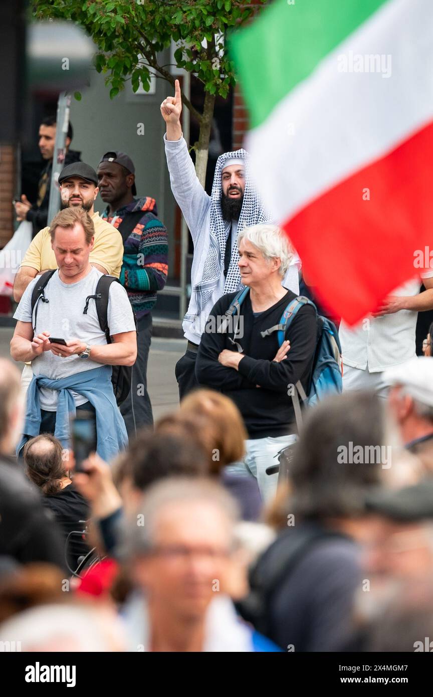 Hamburg, Germany. 04th May, 2024. A man raises his finger (Islamic ...