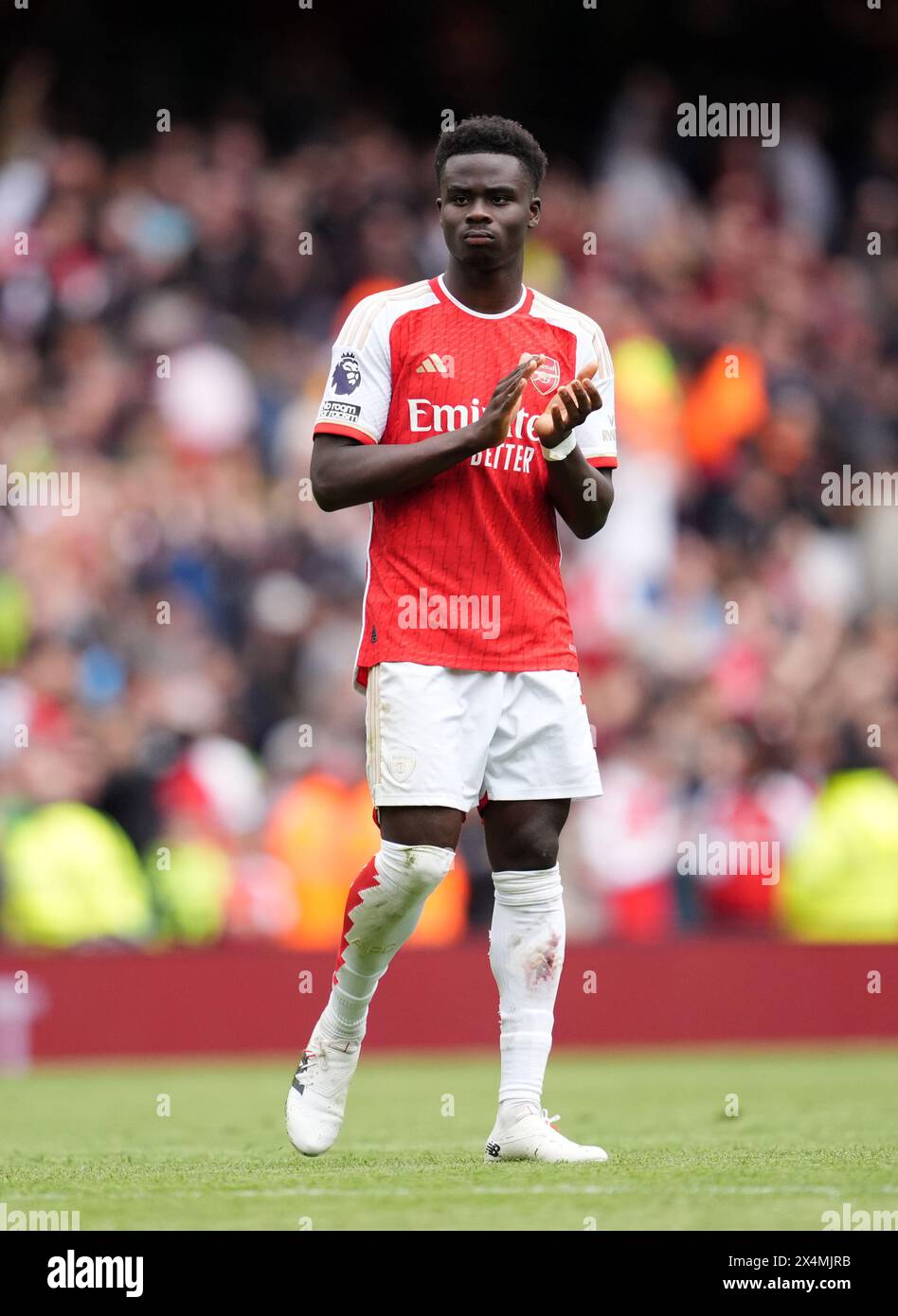 Arsenal's Bukayo Saka celebrates after the Premier League match at the ...
