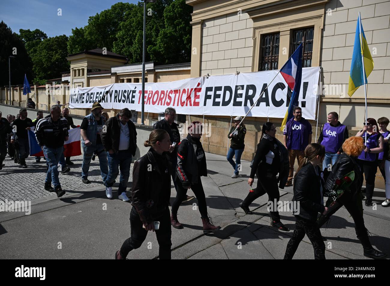 A large banner with the inscription "We welcome the delegates of the ...