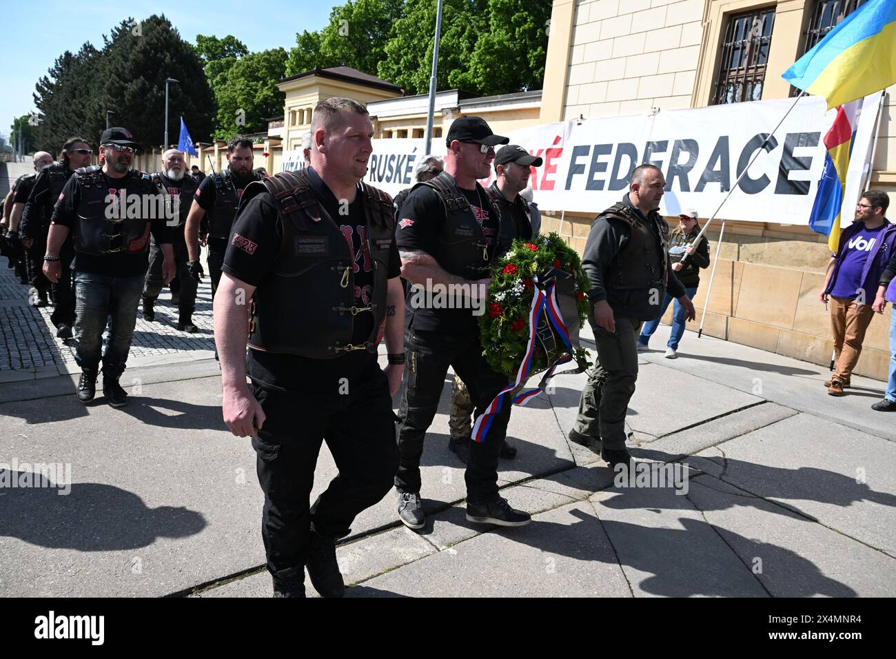 A large banner with the inscription "We welcome the delegates of the ...
