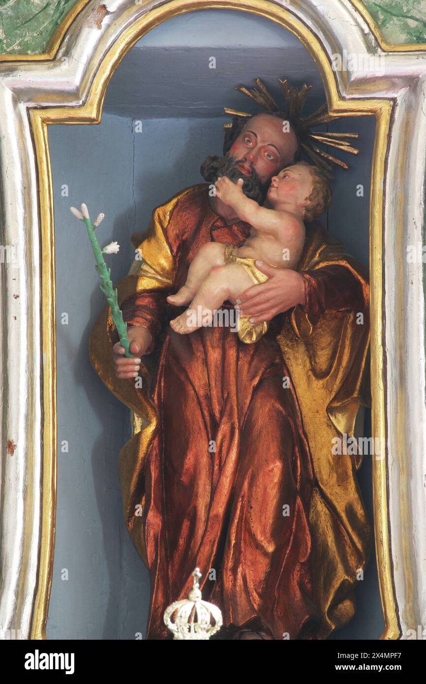 Saint Joseph with the child Jesus, statue on the altar of Saint Joseph ...