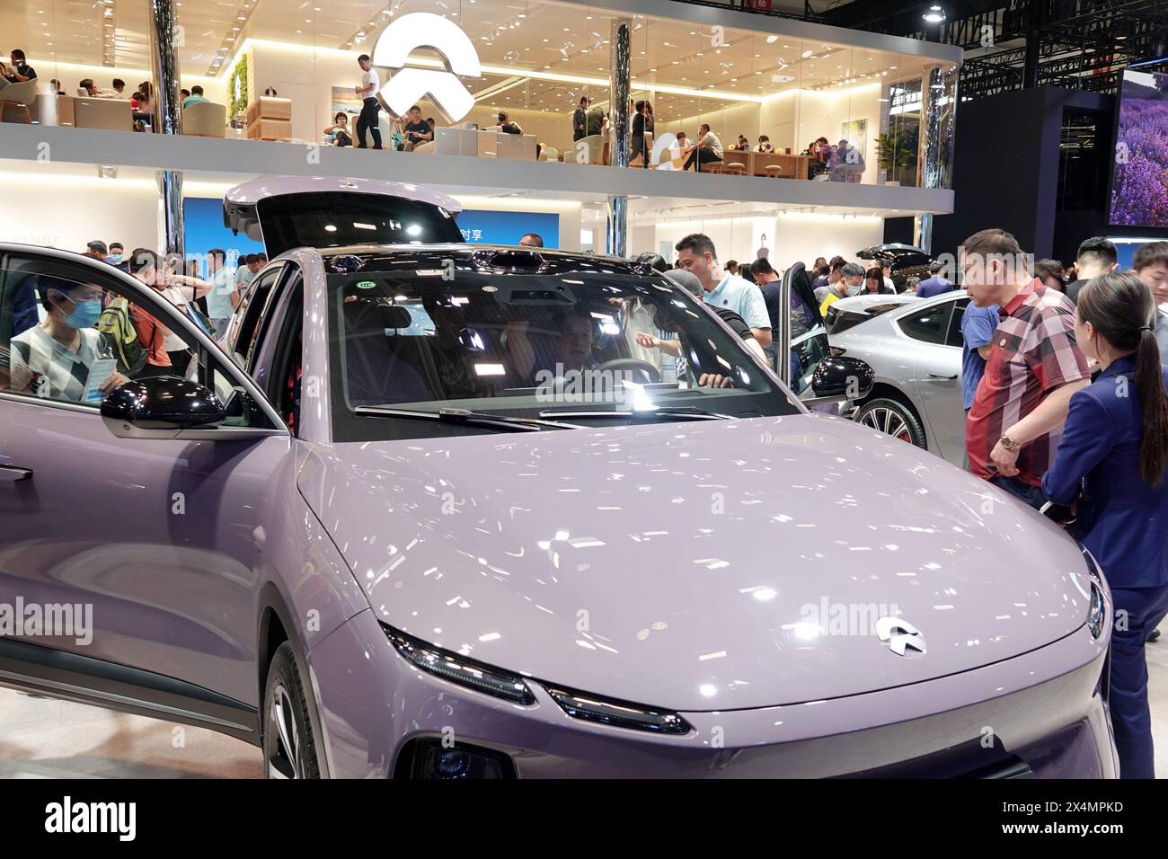 BEIJING, CHINA - MAY 3, 2024 - Visitors look at NIO electric cars at ...