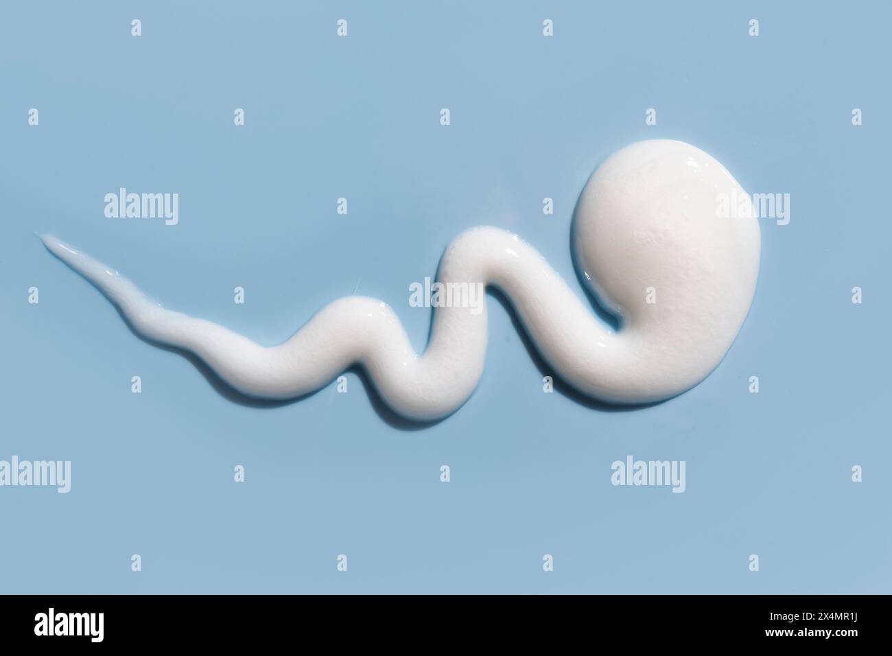 Cosmetic cream gel smudge drop texture on blue background. Sample of ...