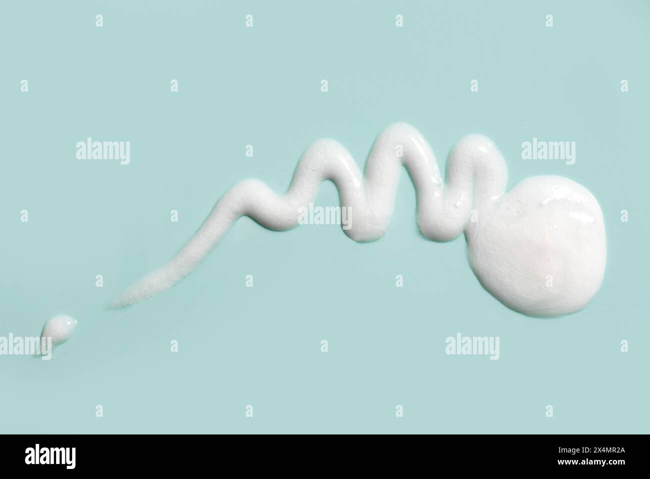 Cosmetic wash gel smudge drop texture on blue background. Sample of ...