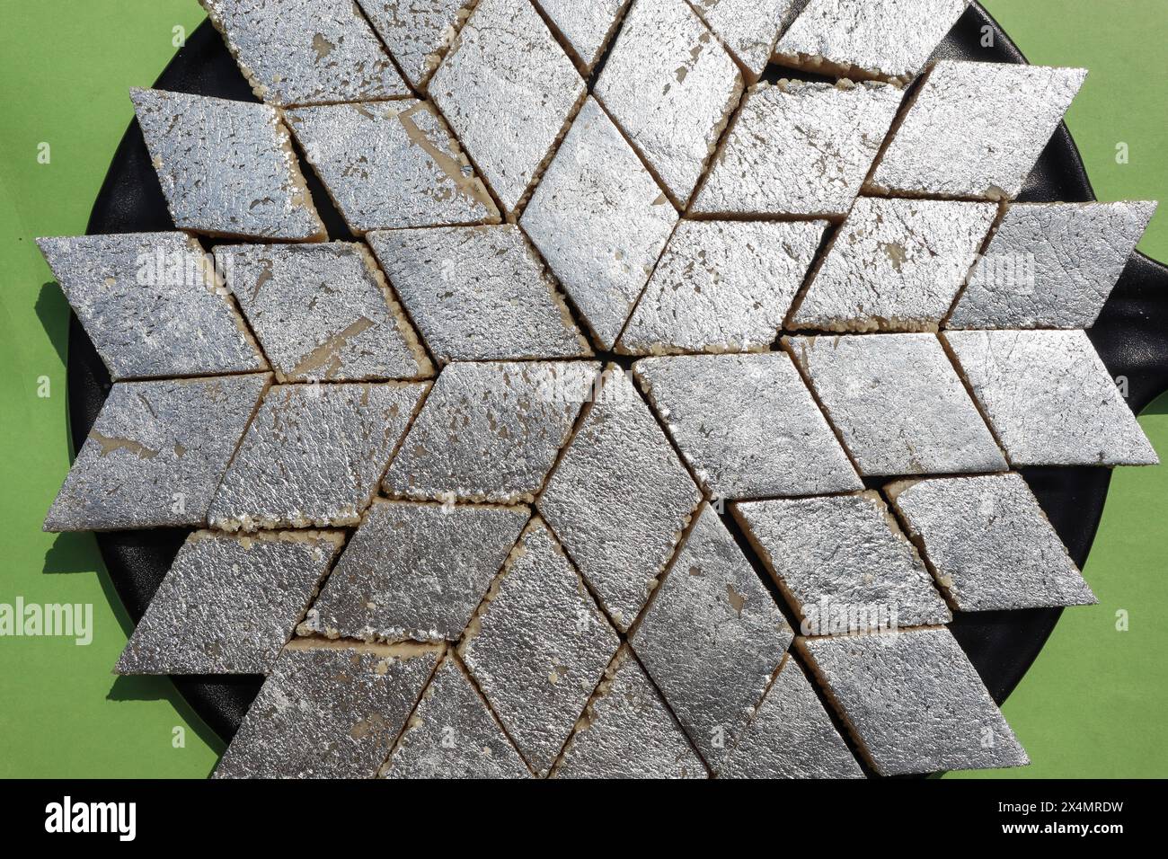 Kaju katli Indian sweets background with silver varak foil. Top view of ...