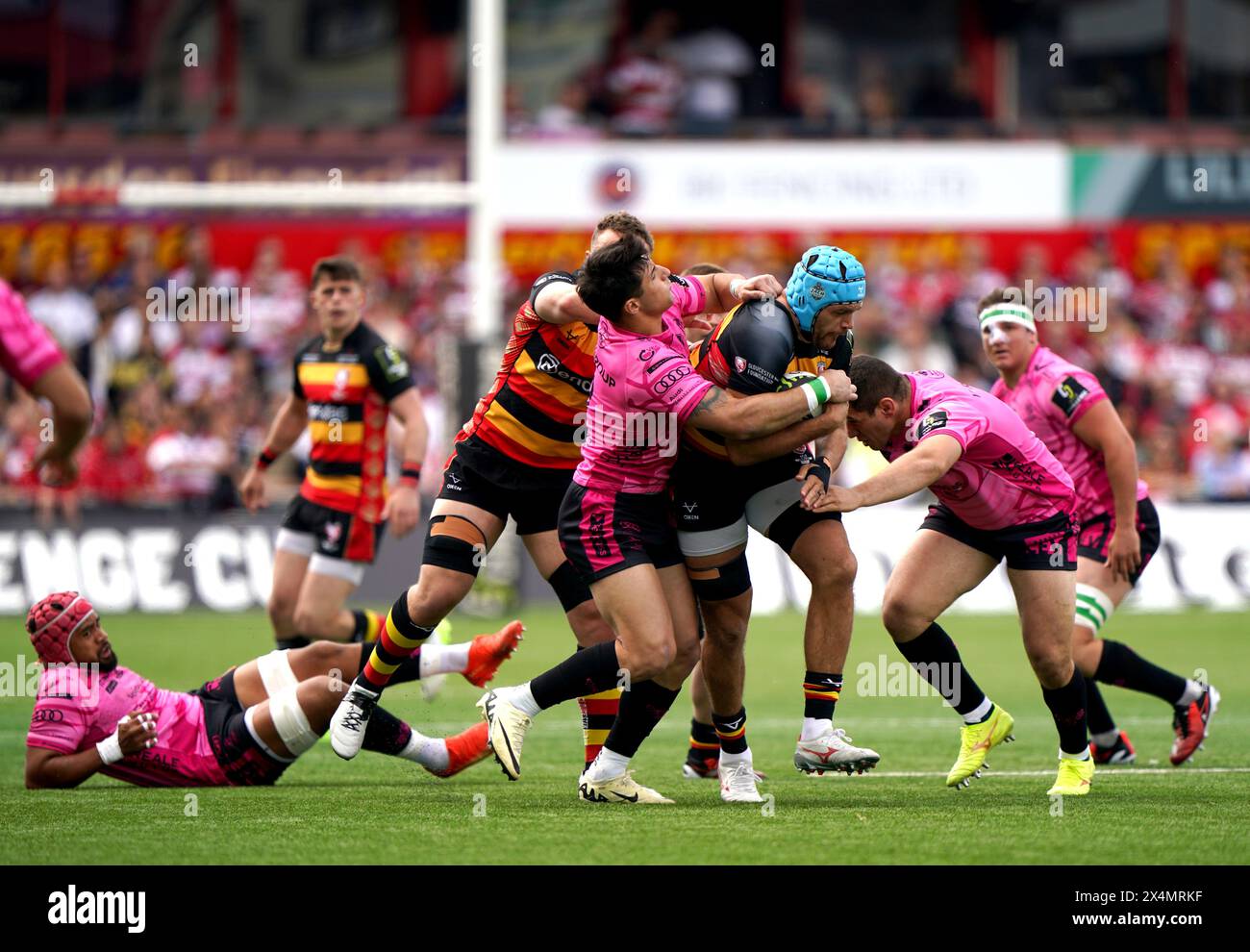 Gloucester Rugby's Zach Mercer is tackled by Benetton Rugby's Tommaso ...