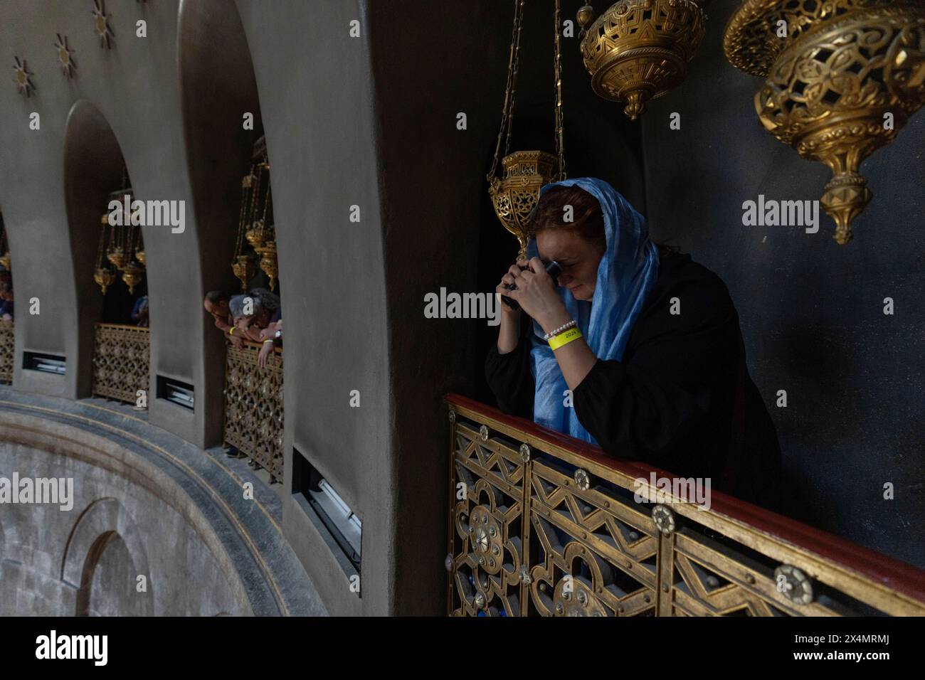 Greek Orthodox pilgrim wait for the ceremony of the Holy Fire at the ...