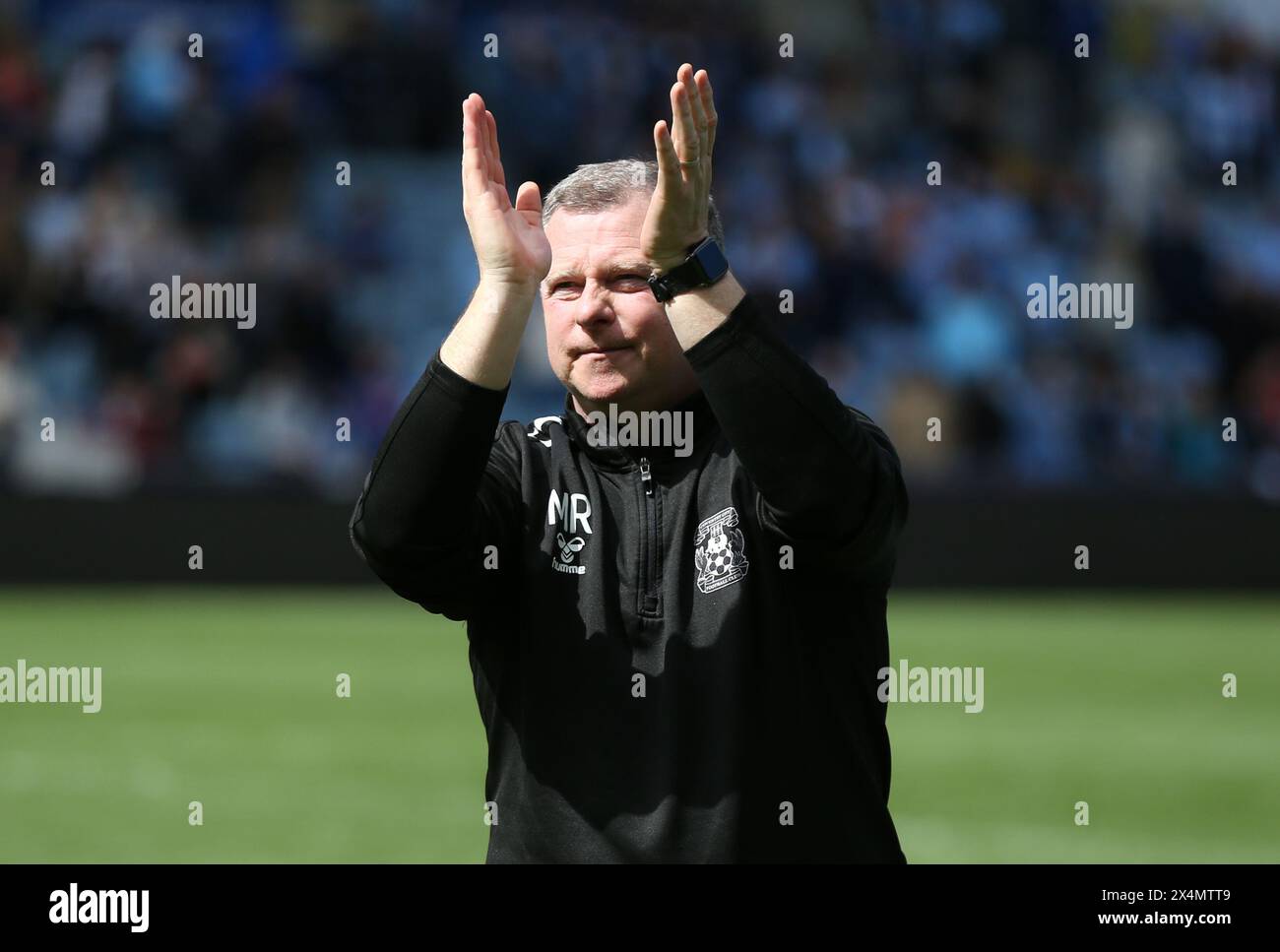 Coventry City manager Mark Robins applauds the fans following the Sky ...