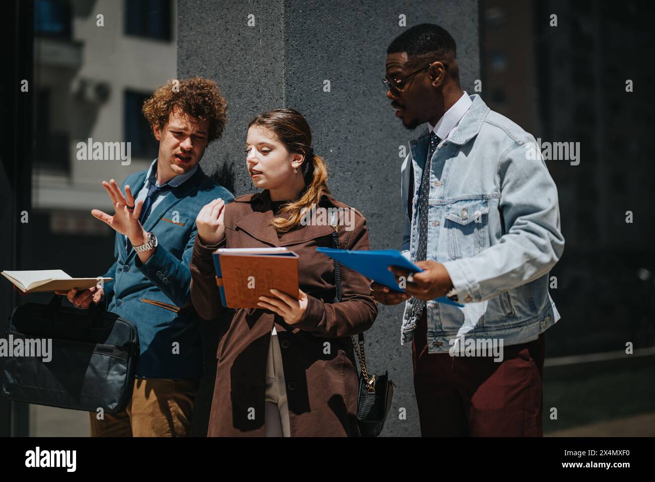 Multicultural team in an engaging discussion during an outdoor business ...