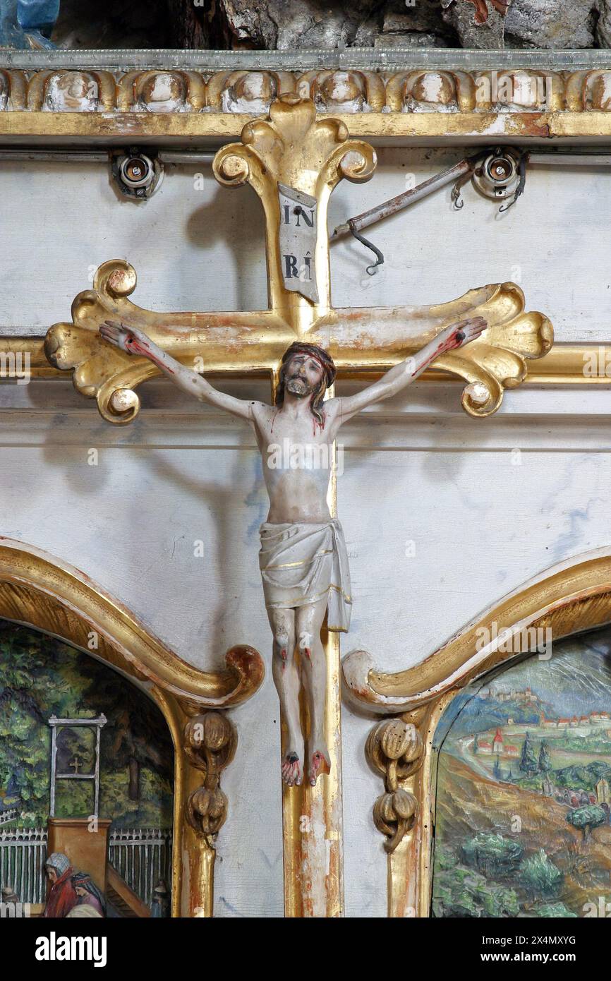 Cross on the altar of Our Lady of Lourdes in the parish church of St ...