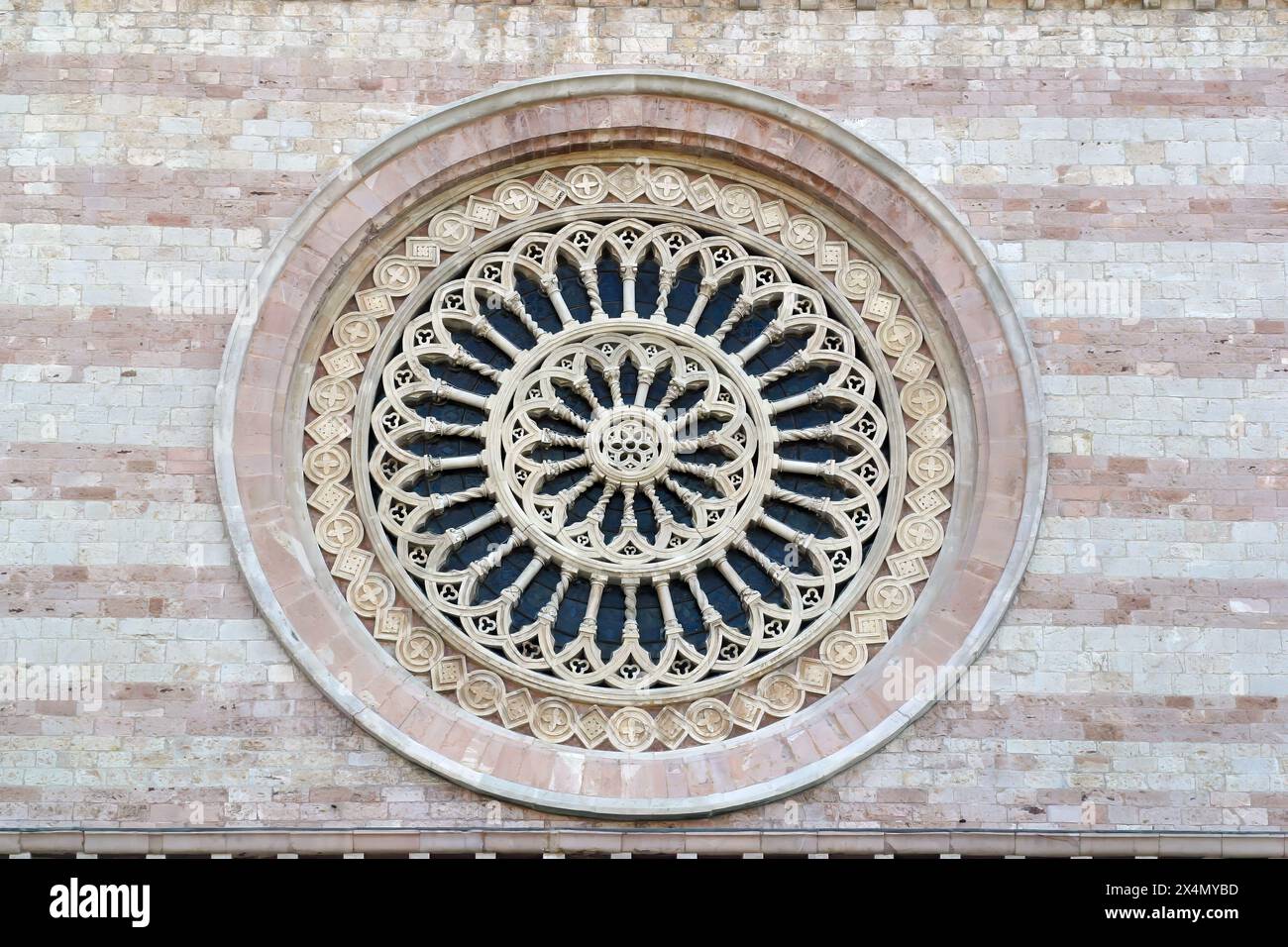 Rose window on the facade of the Basilica of Santa Chiara in the famous ...