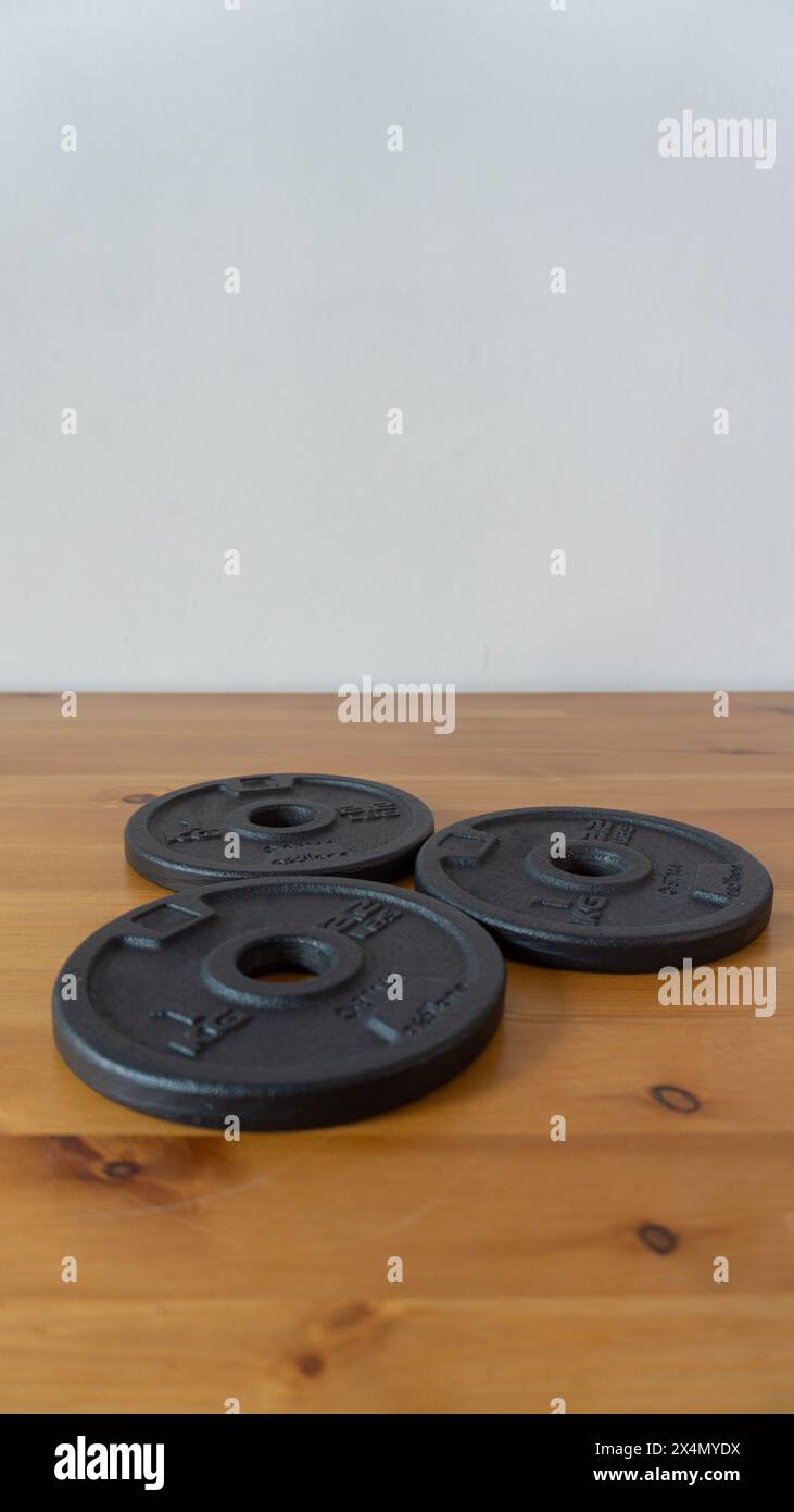 Classic, robust, gym iron plates Stock Photo - Alamy
