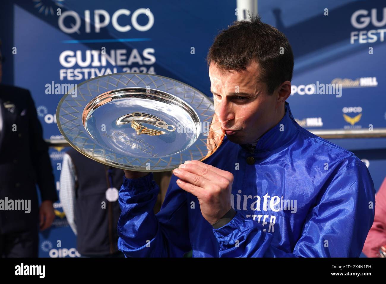 Jockey William Buick celebrates with the trophy after winning the QIPCO ...