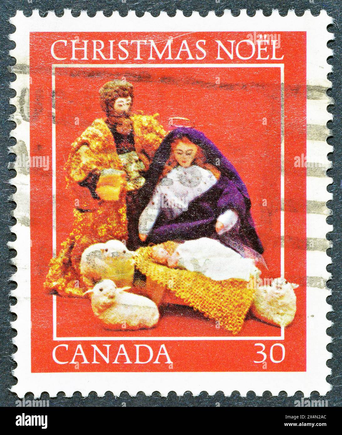 Cancelled postage stamp printed by Canada, that shows Mary, Joseph and ...
