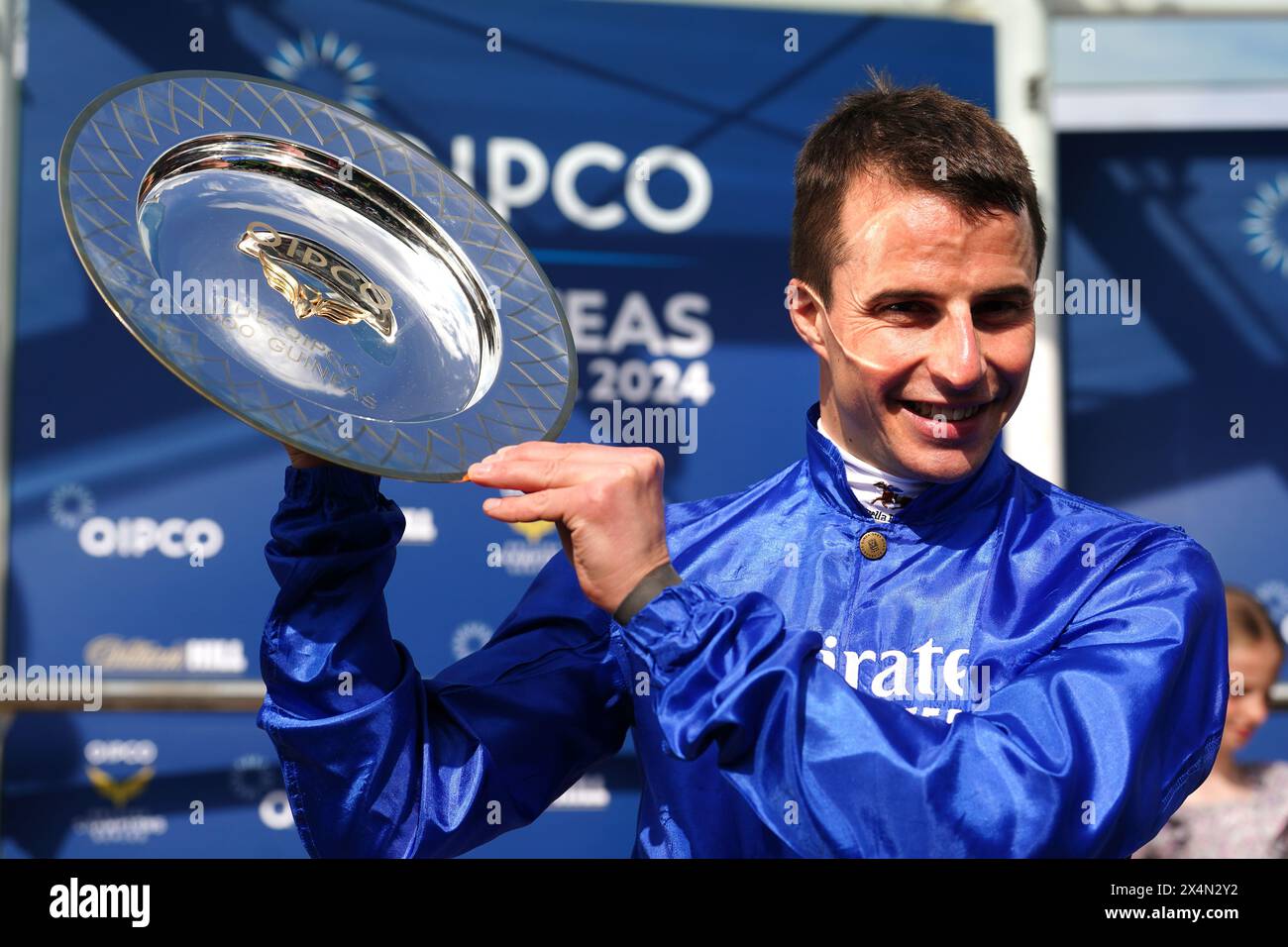 Jockey William Buick celebrates with the trophy after winning the QIPCO ...