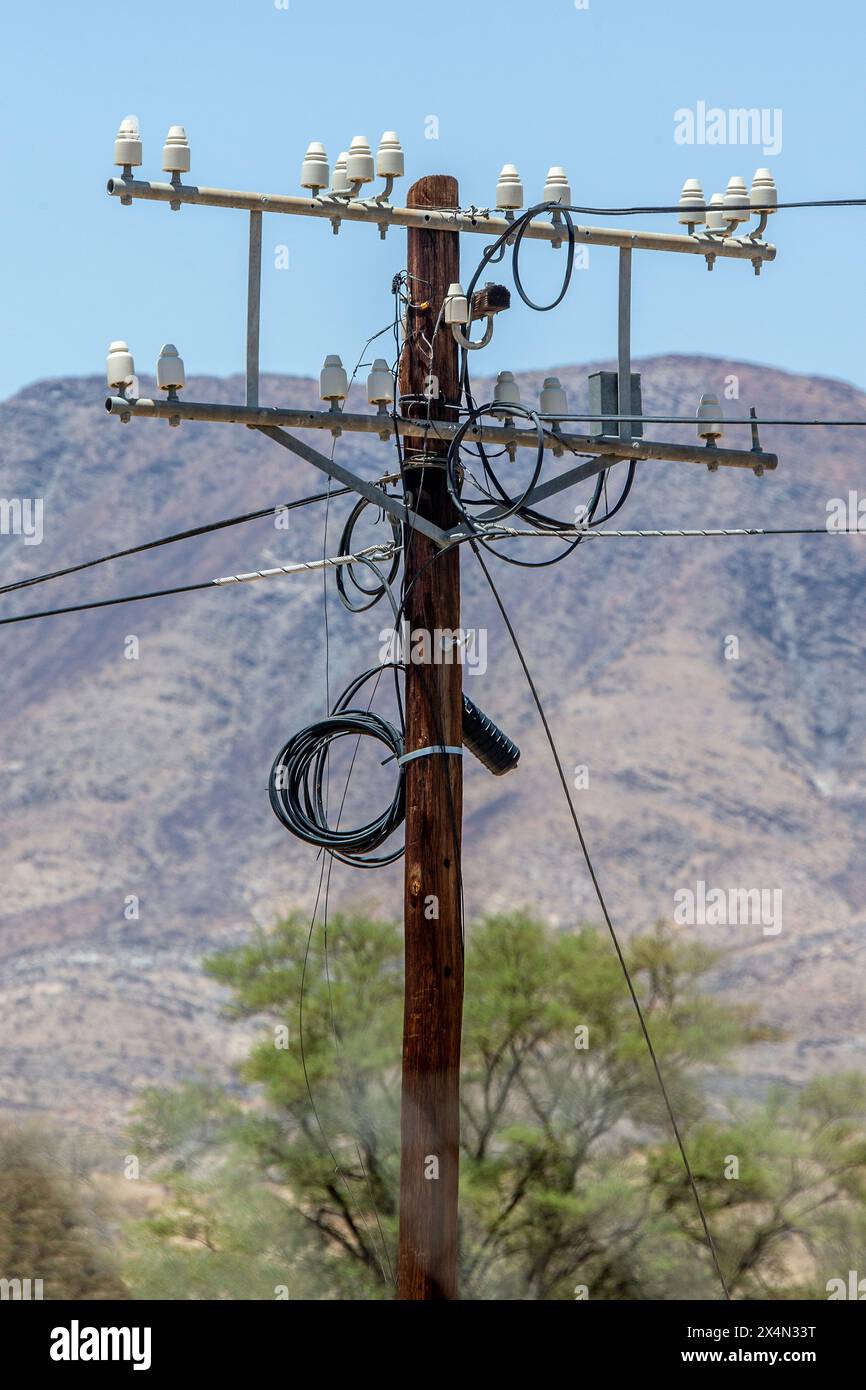 Old white, bakelite fittings on a telegraph pole with cables replaced ...