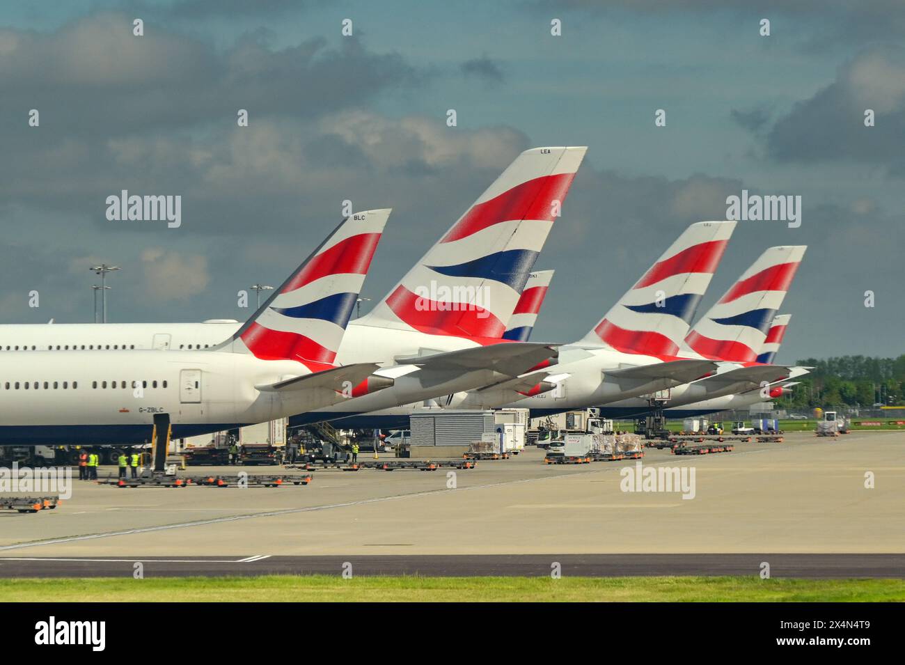 London, England, UK - 4 May 2024: Row of tail fins of planes operated ...