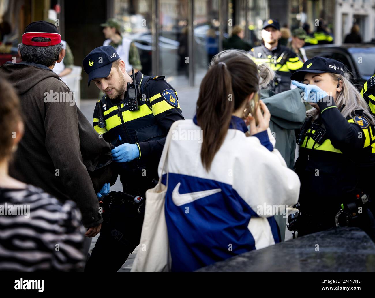 AMSTERDAM - Police check visitors to Dam Square prior to the National ...