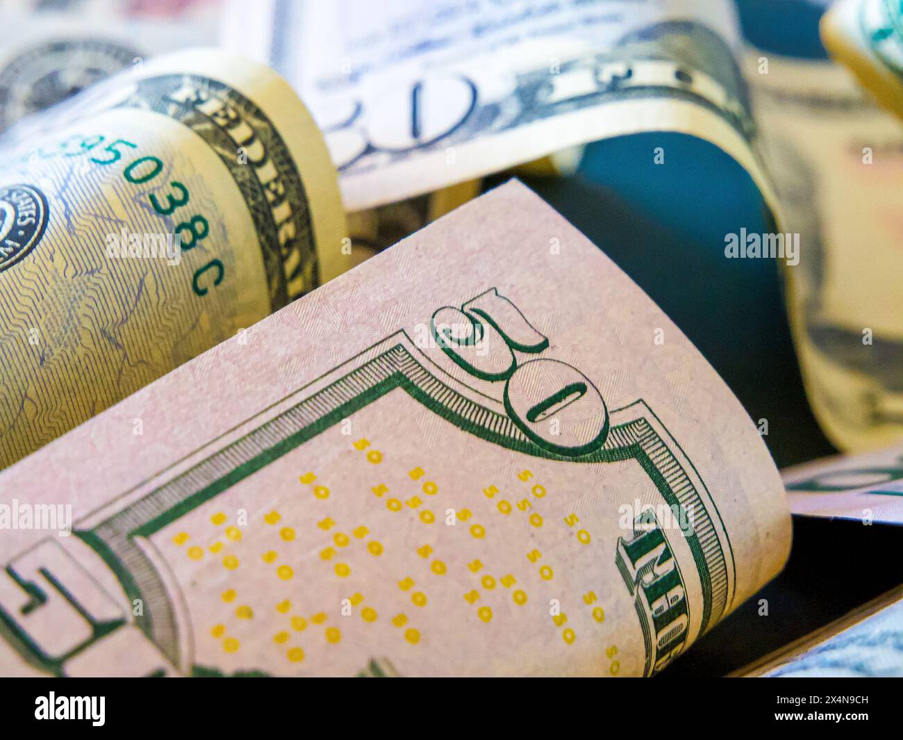 Currency Display. A mix of rolled and unrolled dollar notes Stock Photo ...