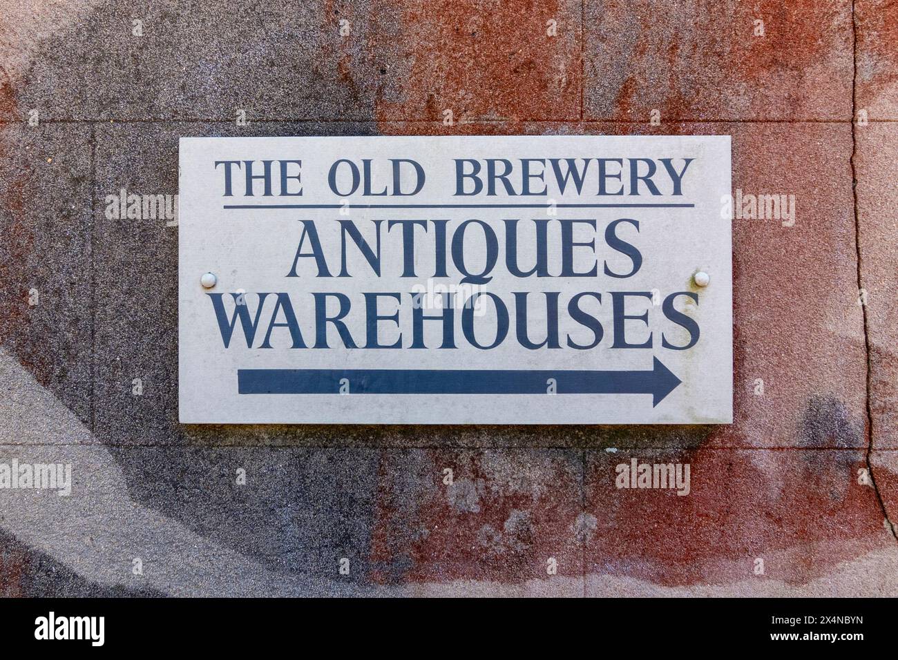 Antiques Business advert / direction indicator Stock Photo - Alamy
