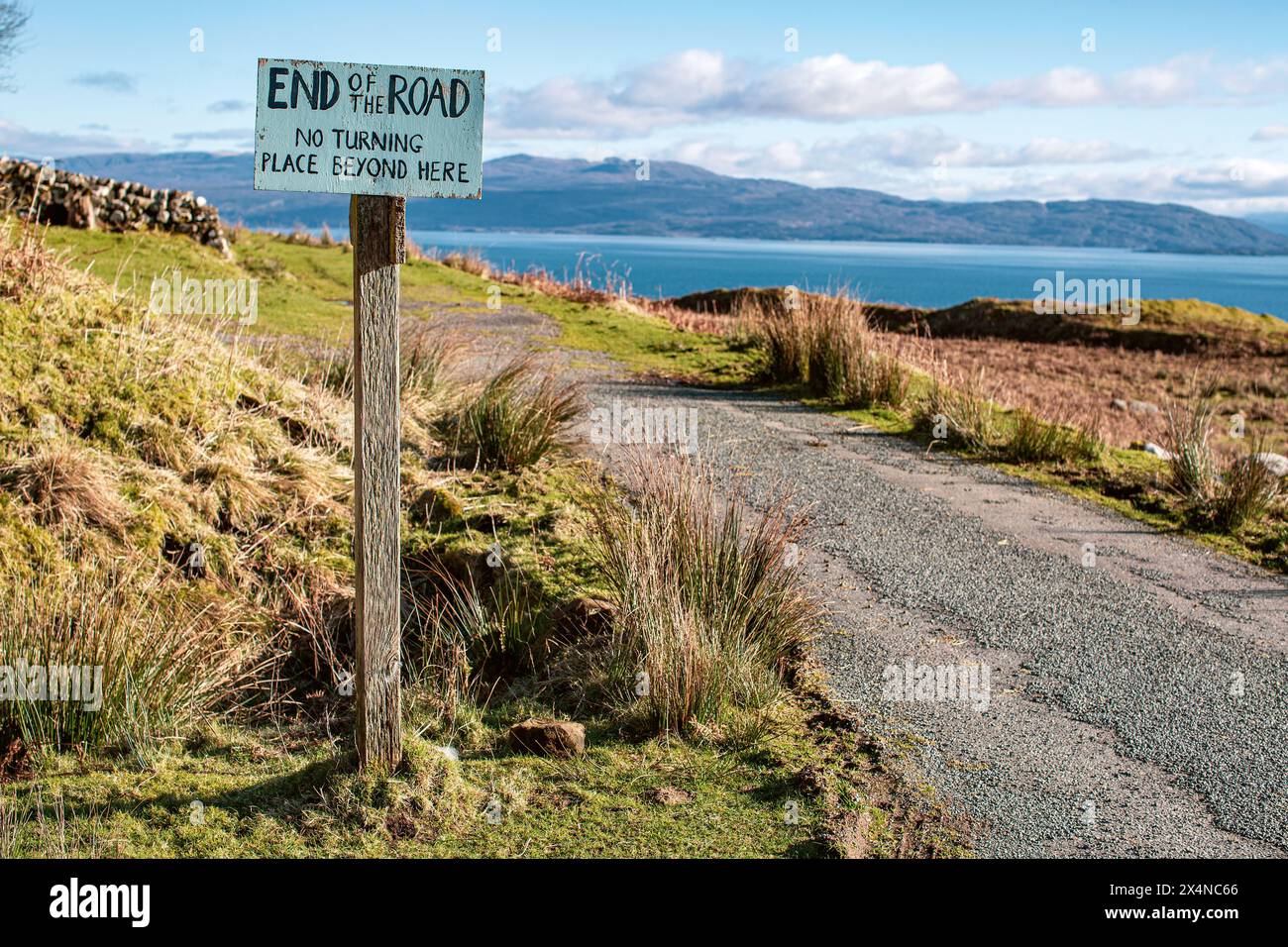 End of the road sign looking across the sound to Isle of Skye on the ...