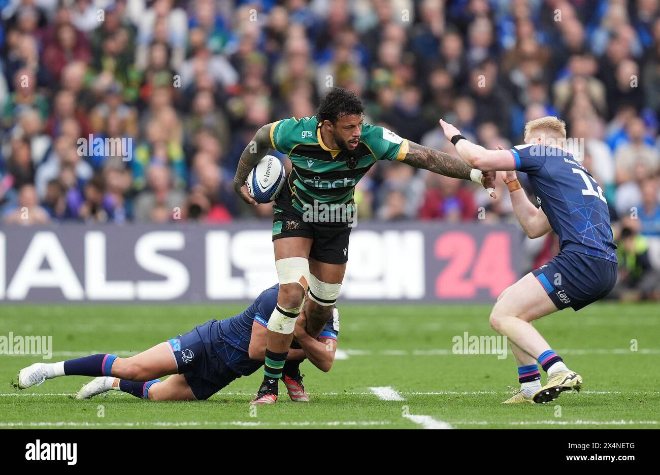 Northamton Saints' Courtney Lawes is tackled by Leinster Rugby's ...