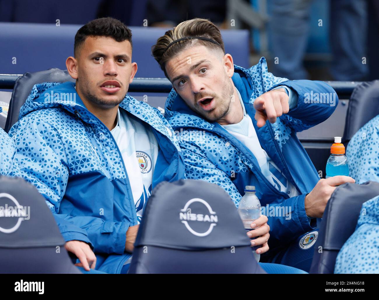 Manchester City's Matheus Nunes (left) and Jack Grealish on the bench ...