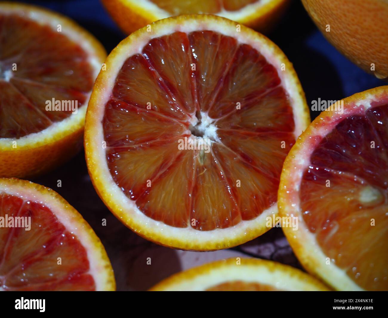 Half-cut Italian blood oranges Stock Photo - Alamy