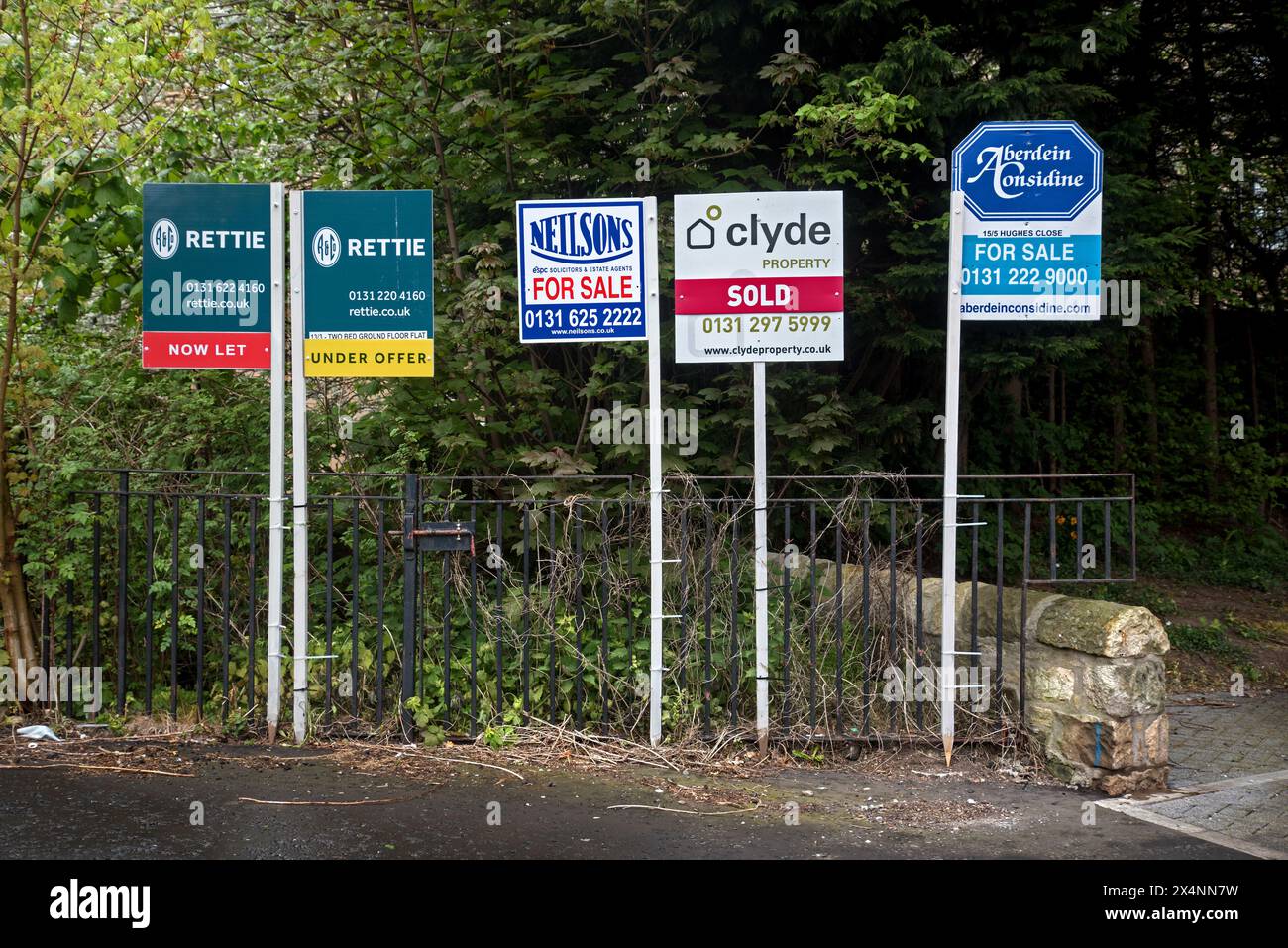 Estate Agent signs attached to railings near residential property in ...