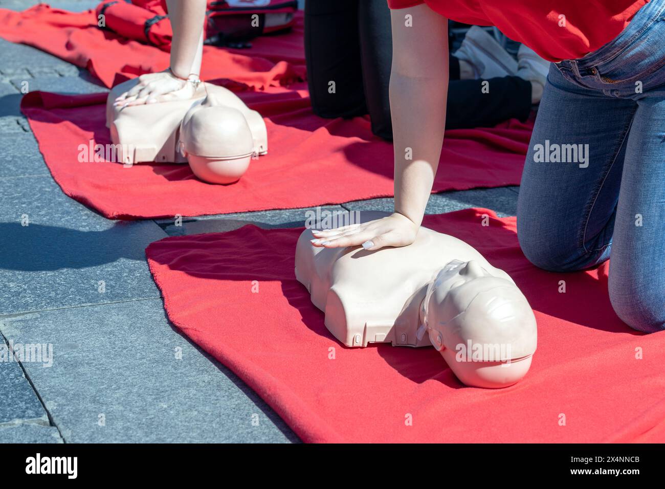 First aid and Cardiopulmonary resuscitation - CPR with one hand for child and both hands for ...