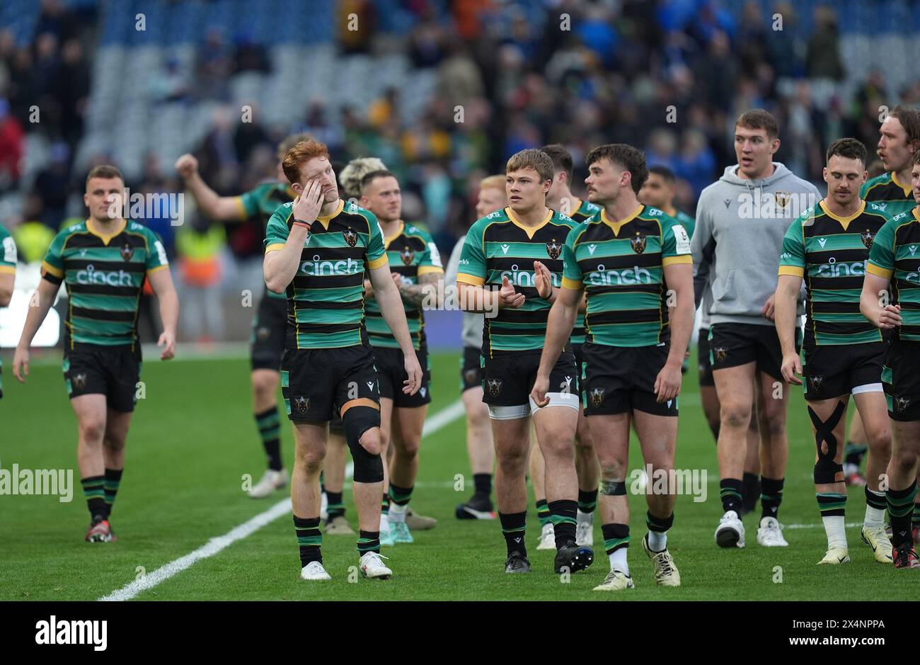 Northampton Saints' George Hendy (left) shows dejection after their ...