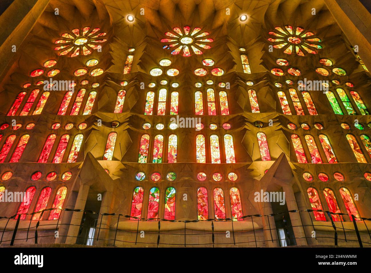 Colourful stained glass windows in the side aisle, Sagrada Familia ...