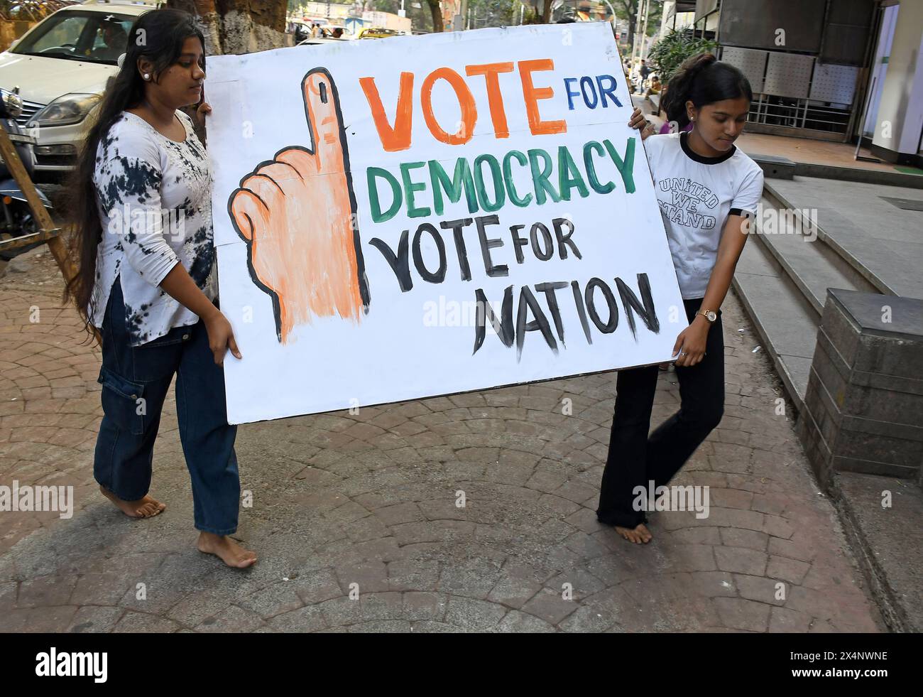 Students from Gurukul school of art are seen carrying a painted poster ...