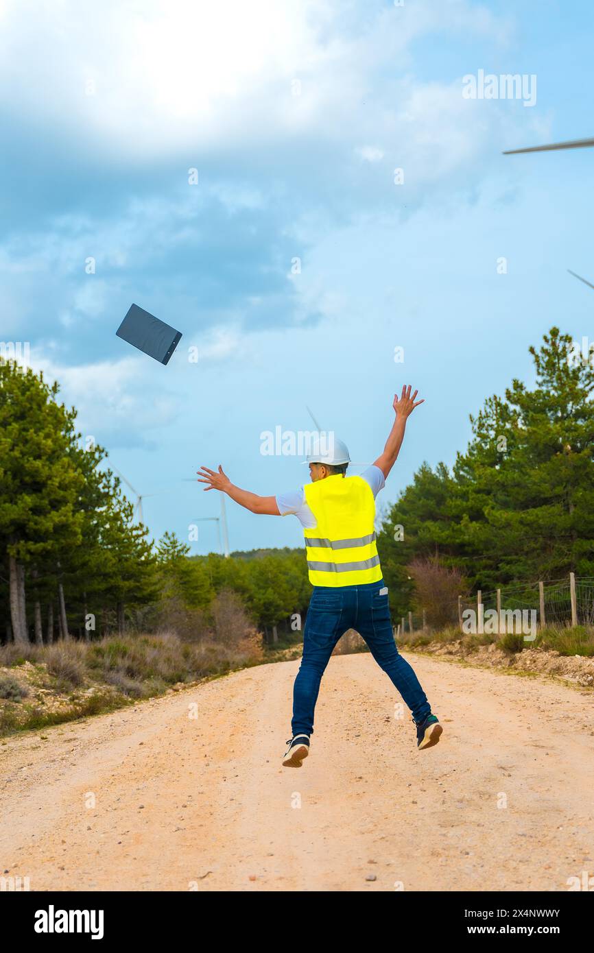 Vertical photo of the rear view of a male adult caucasian happy ...