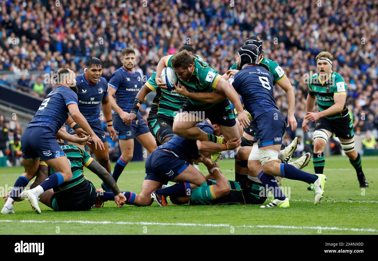 Northampton Saints' Elliot Millar-Mills (centre) is tackled by Leinster ...