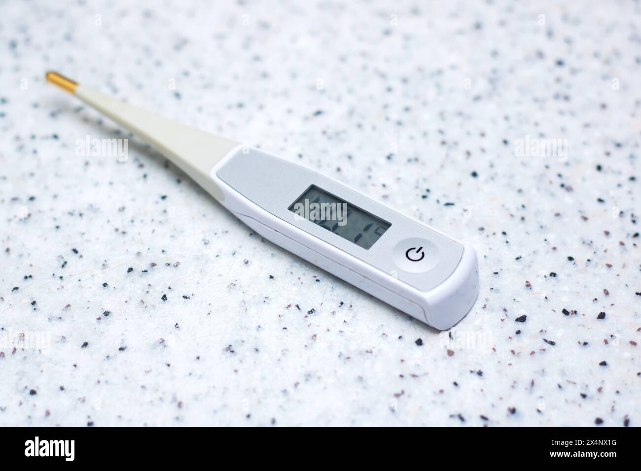 a digital thermometer shows a temperature of 40.1 degrees celsius High ...