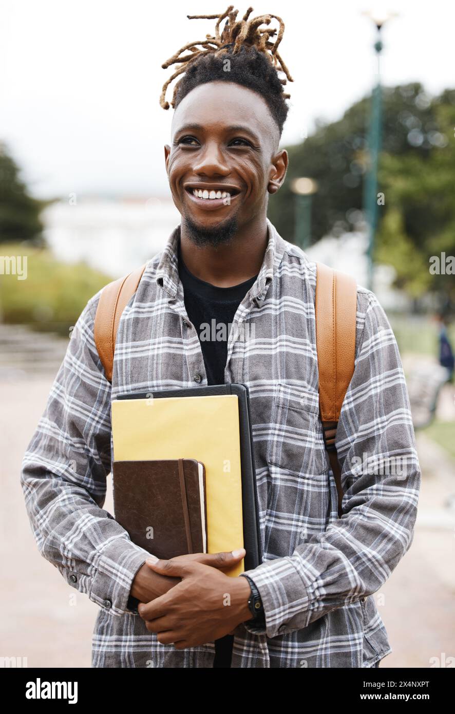 Student, college and black man, outdoor and books to study, smile and ...