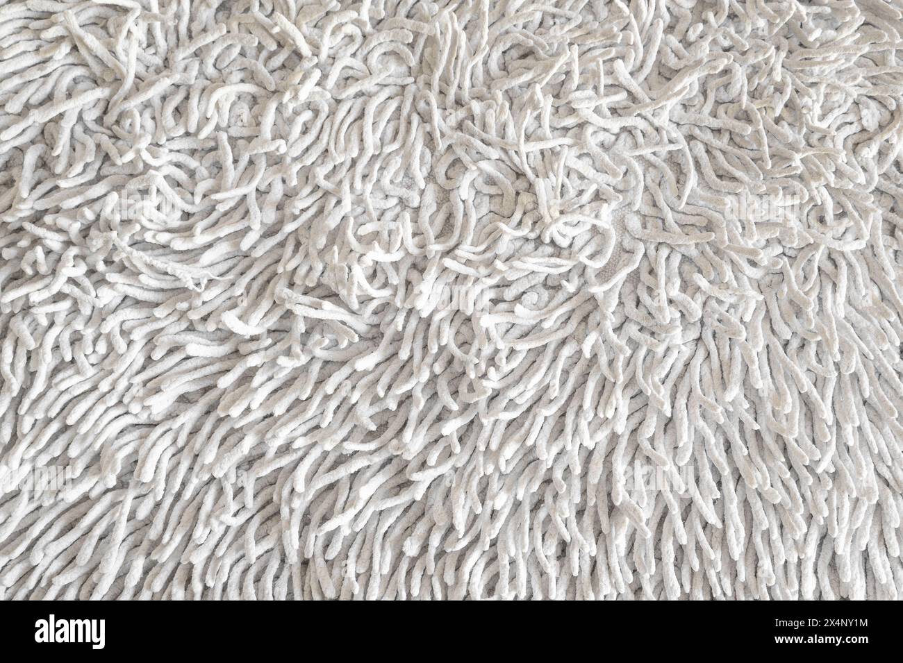 looped cotton fabric. Skeins of plush yarn for hand knitting with ready ...