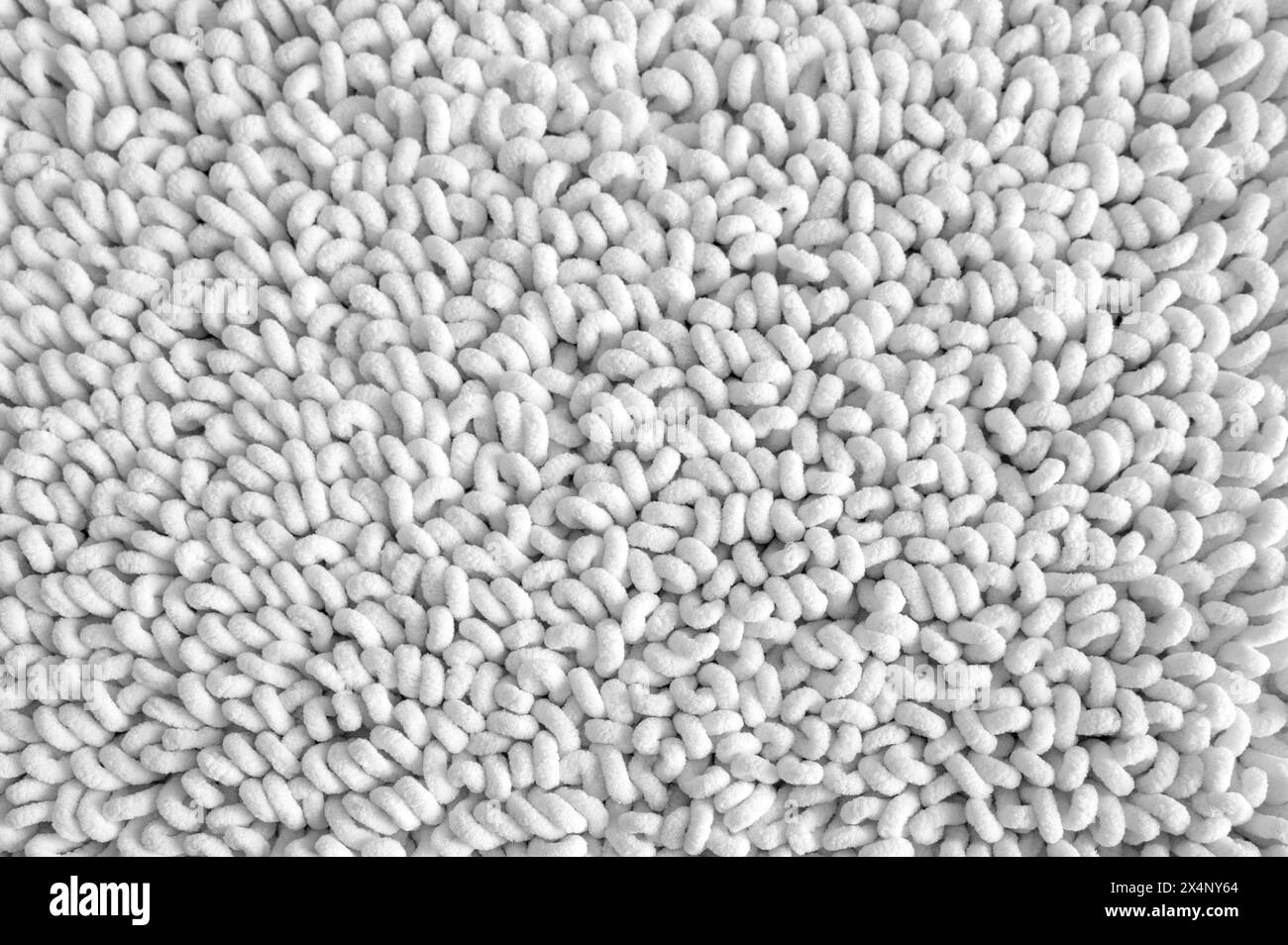 looped cotton fabric. Skeins of plush yarn for hand knitting with ready ...