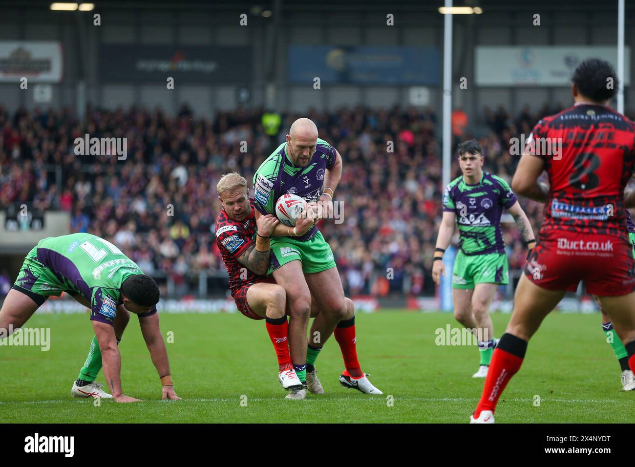***Liam Watts is tackled during the Super League match between Leigh ...
