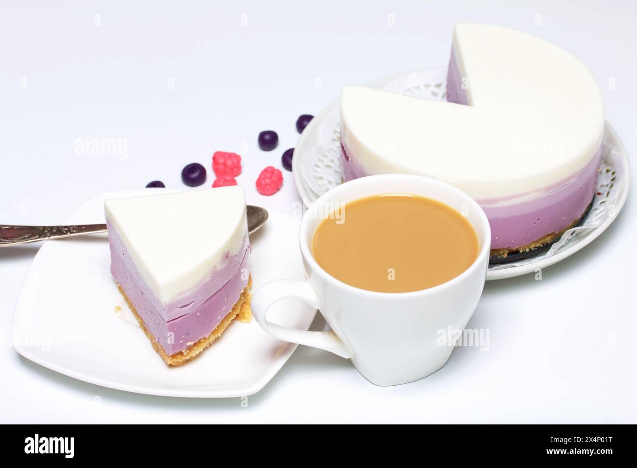 Blueberry cheesecake. A piece of ready-made dessert on a saucer. Jelly ...