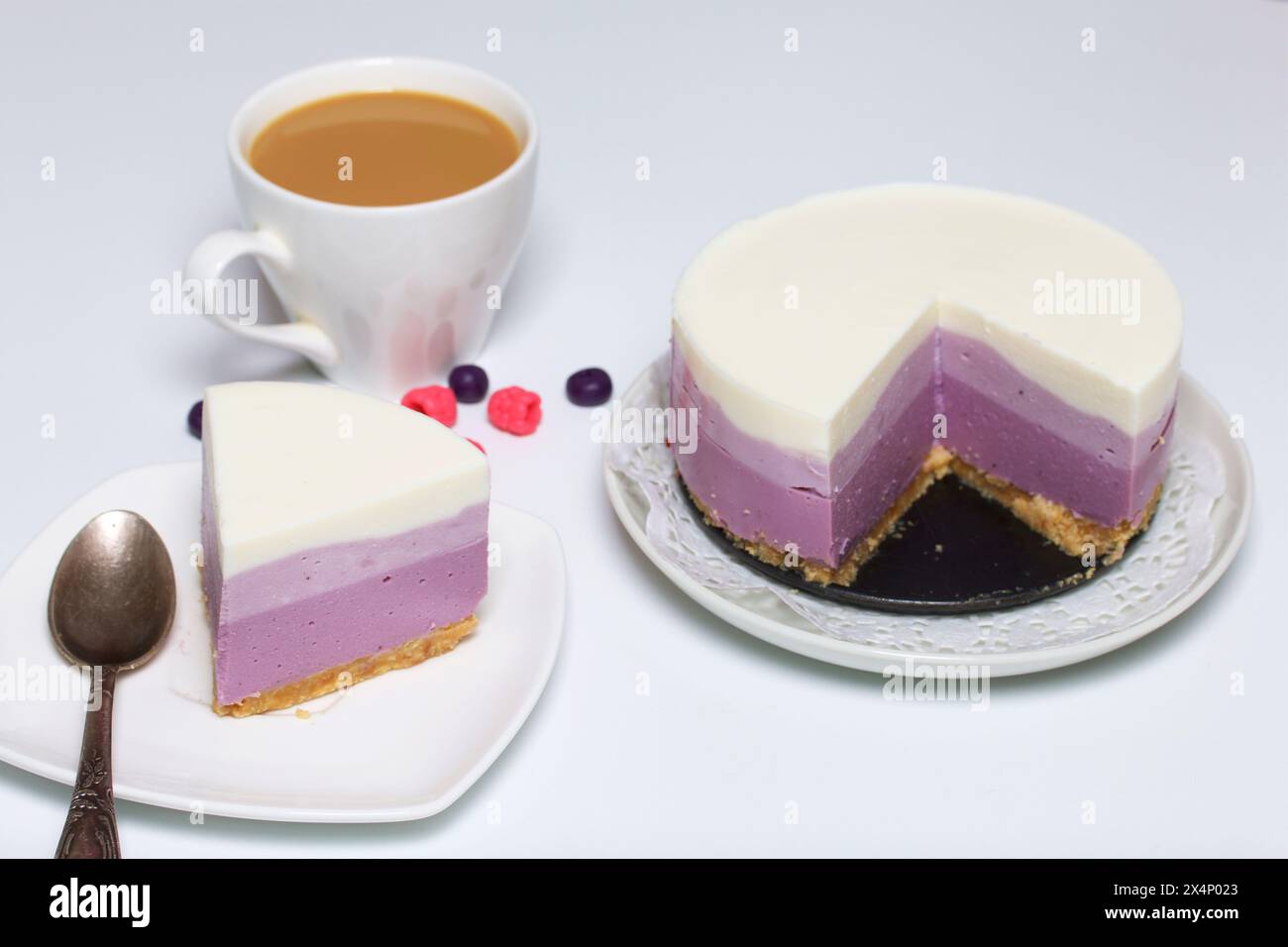 Blueberry cheesecake. A piece of ready-made dessert on a saucer. Jelly ...