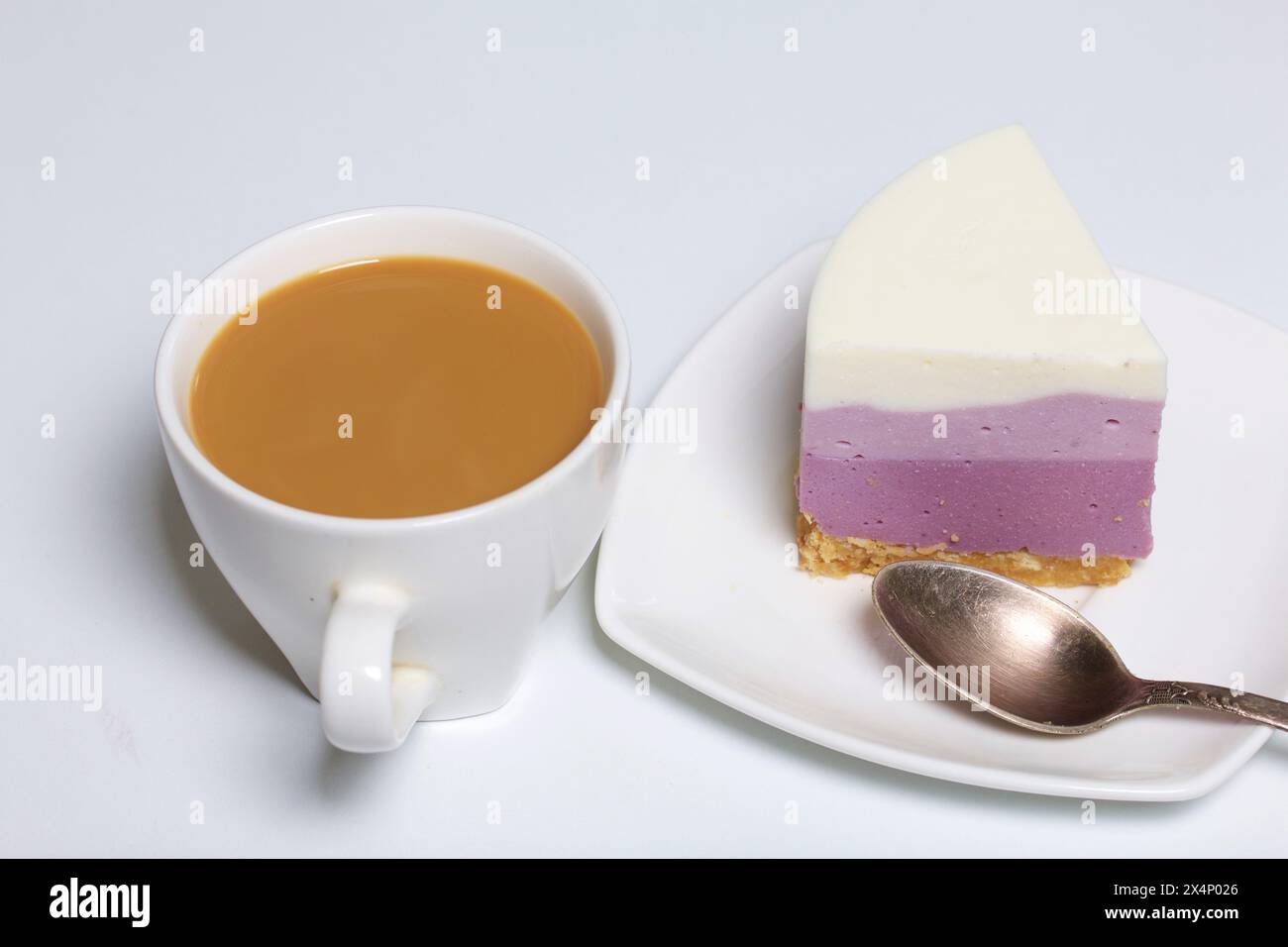 Blueberry cheesecake. A piece of ready-made dessert on a saucer. Jelly ...